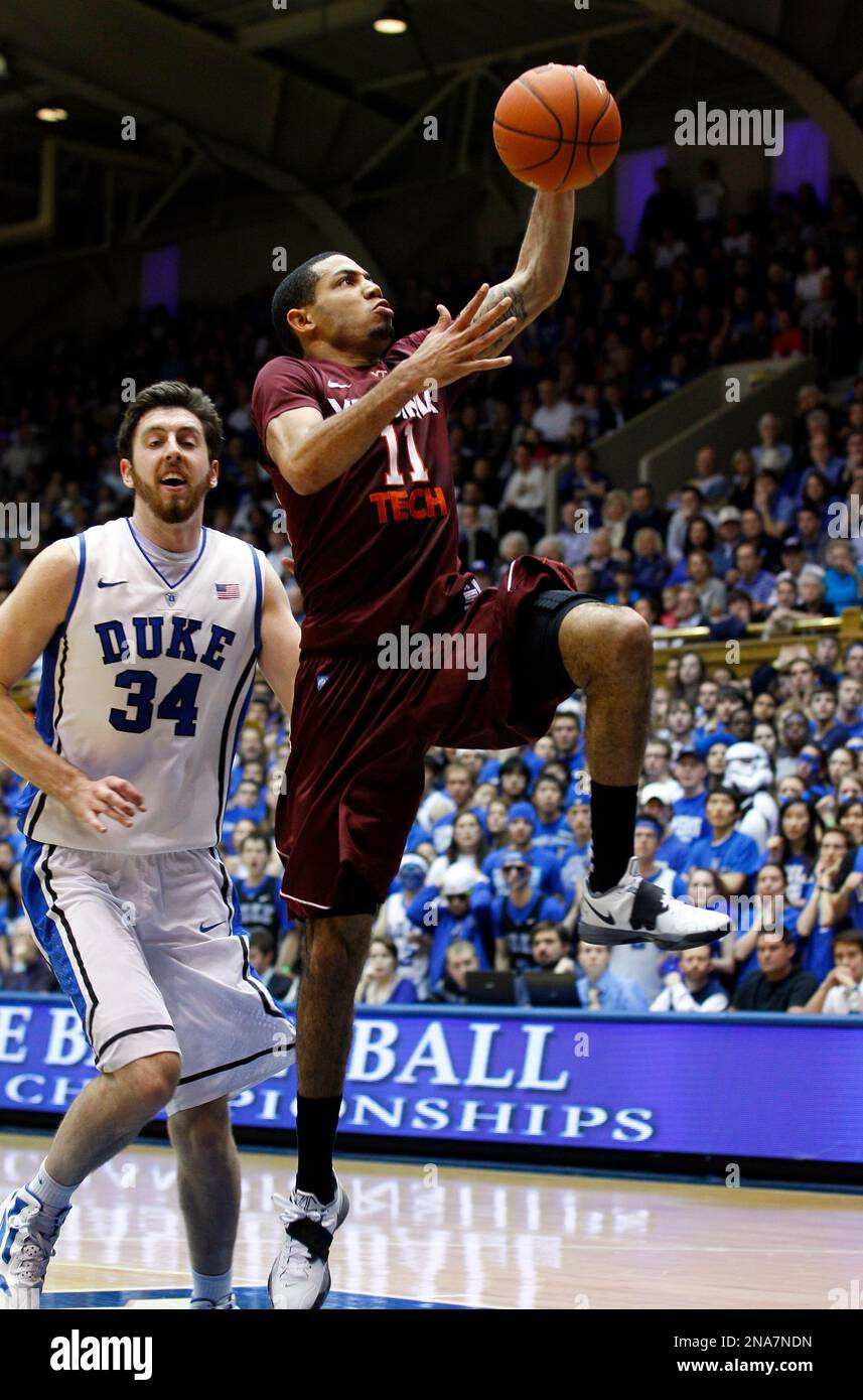 Virginia Tech's Erick Green (11) drives past Duke's Ryan Kelly (34 ...