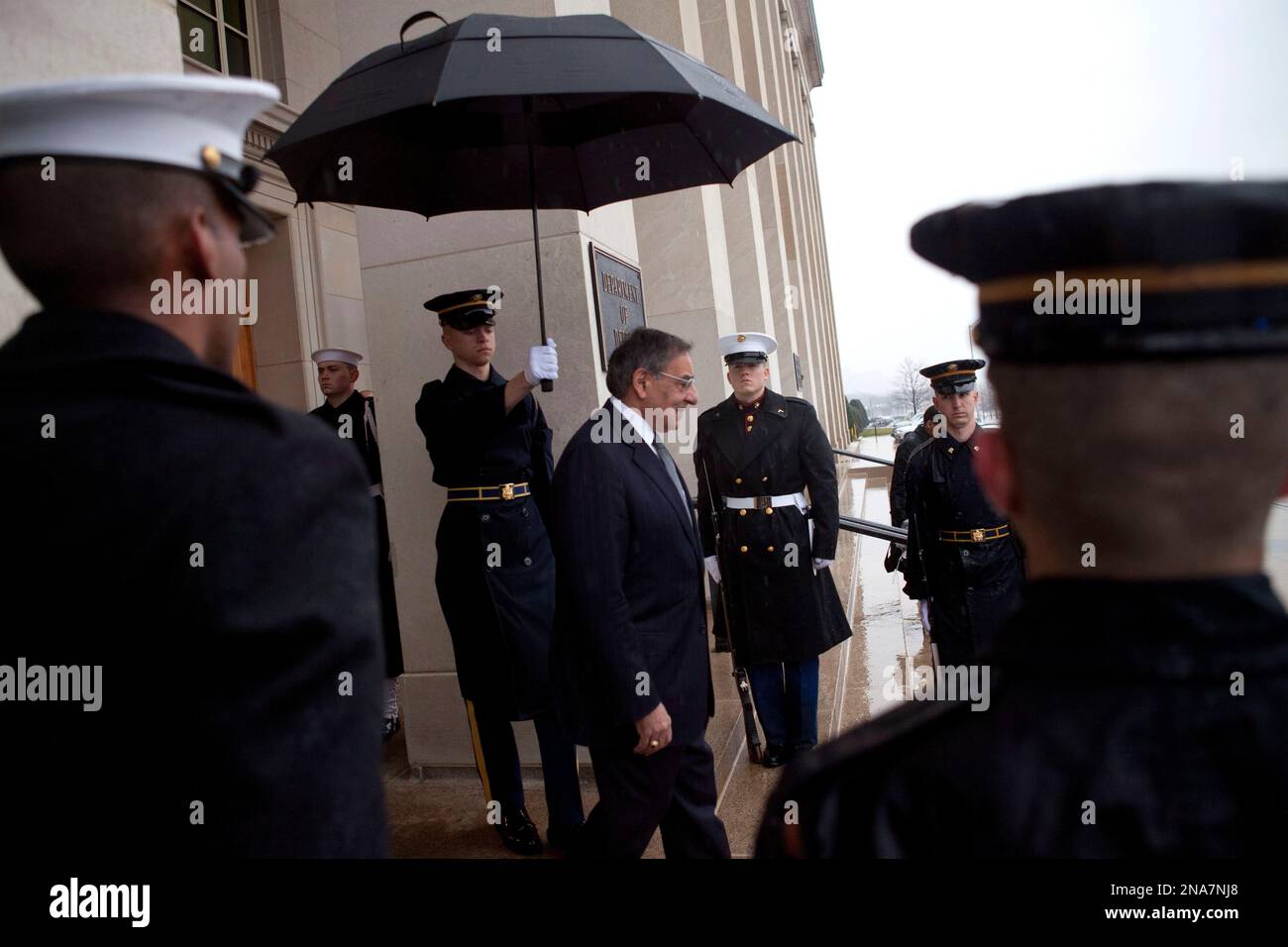 Defense Secretary Leon Panetta walks through honor cordon soldiers to ...