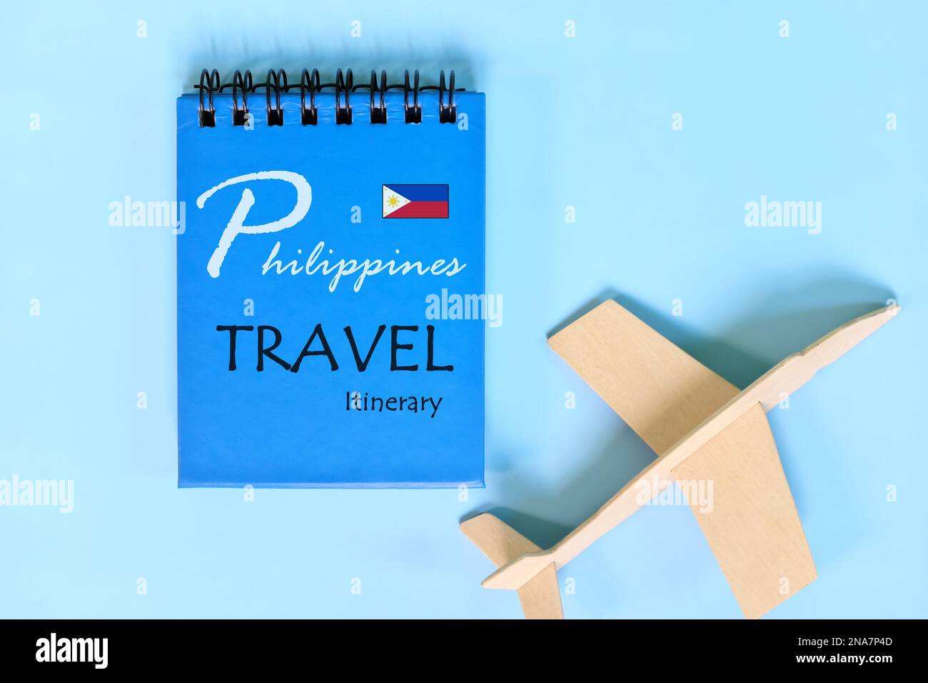 Philippines travel plan or itinerary written on blue notepad with flag ...