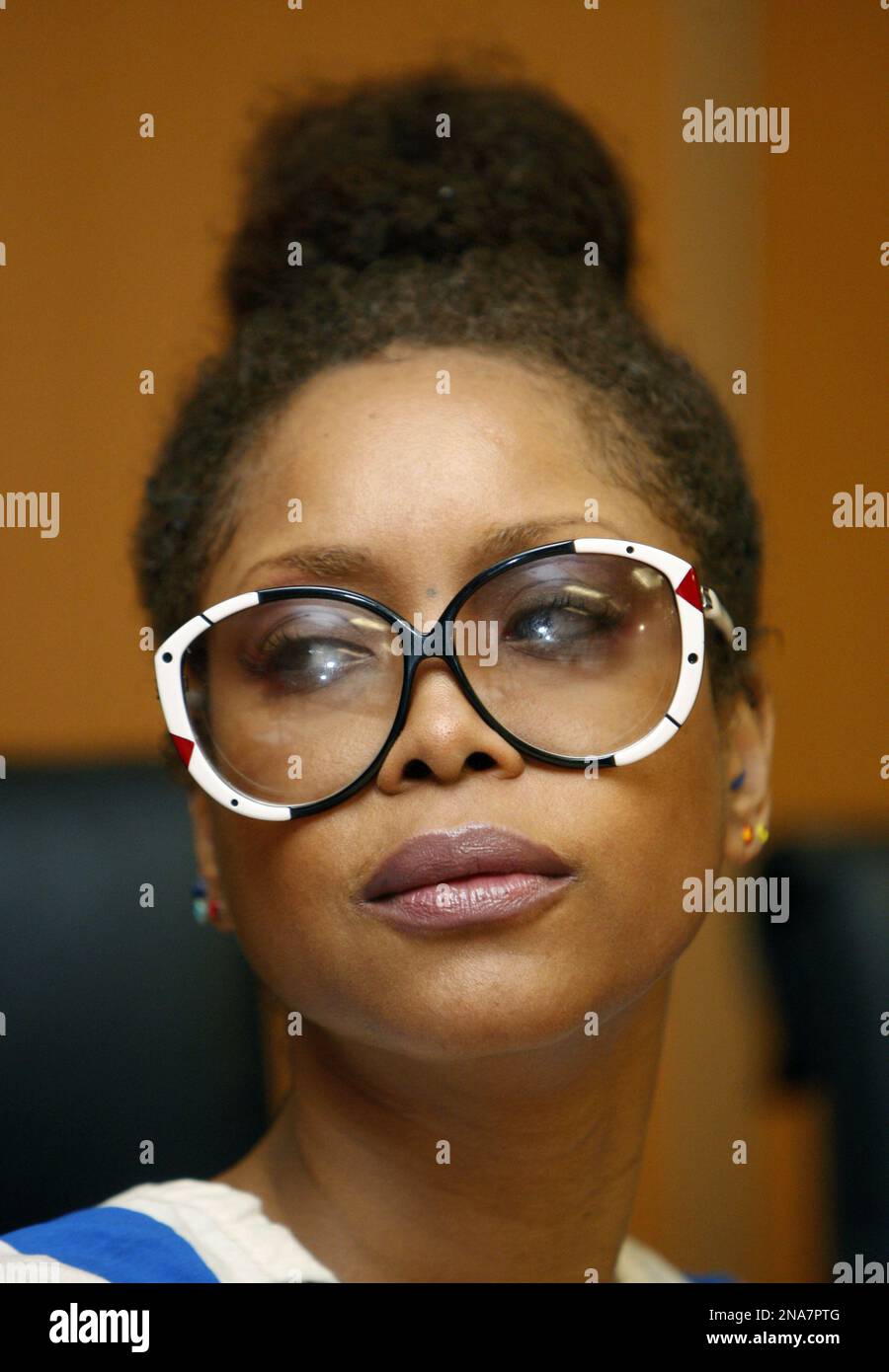 U.S. singer Erykah Badu listens during a press conference in Kuala ...