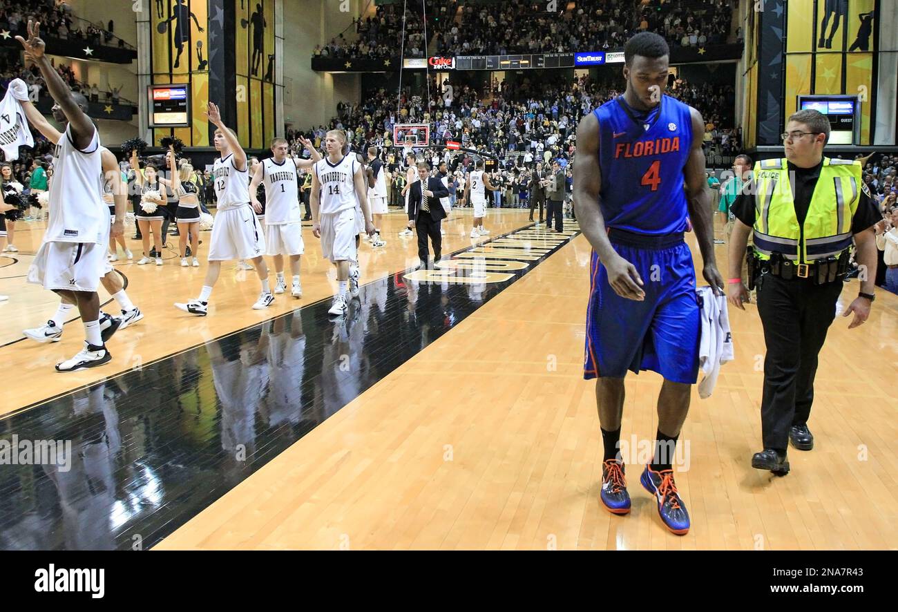 Florida center Patric Young (4) leaves the court as Vanderbilt players ...