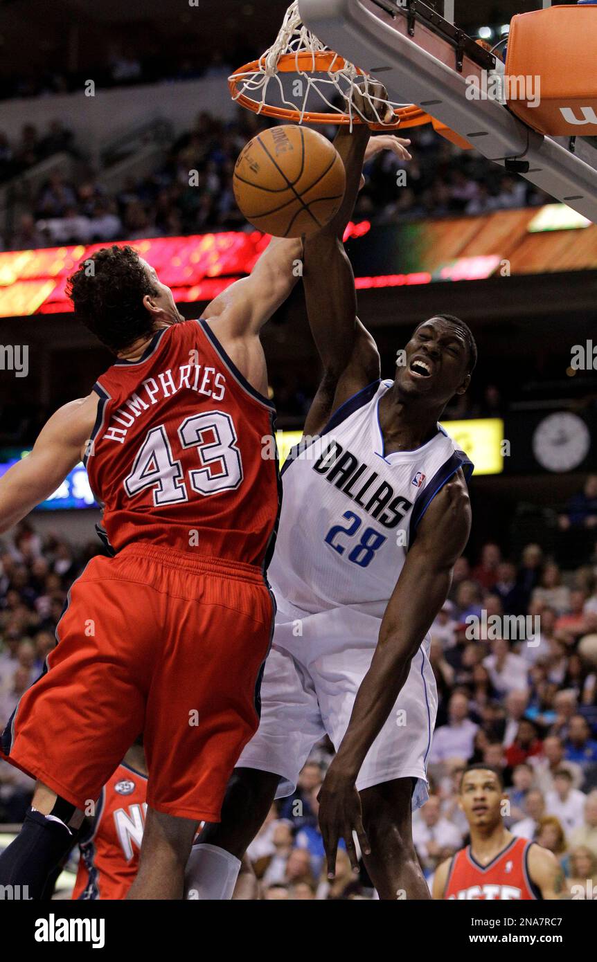 Dallas Mavericks' Ian Mahinmi (28) of France dunks against New Jersey ...