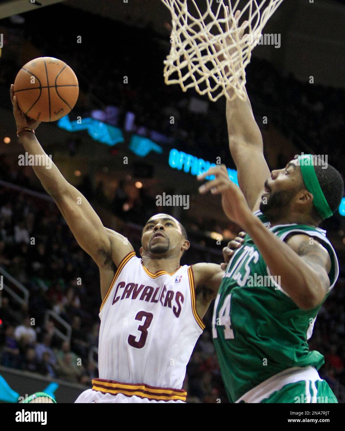 Cleveland Cavaliers' Ramon Sessions shoots over Boston Celtics' Chris ...