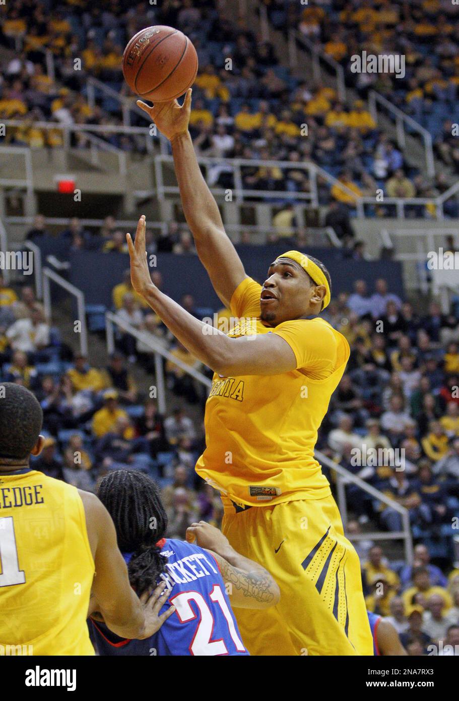 West Virginia's Kevin Jones (5) shoots over DePaul defenders in the ...