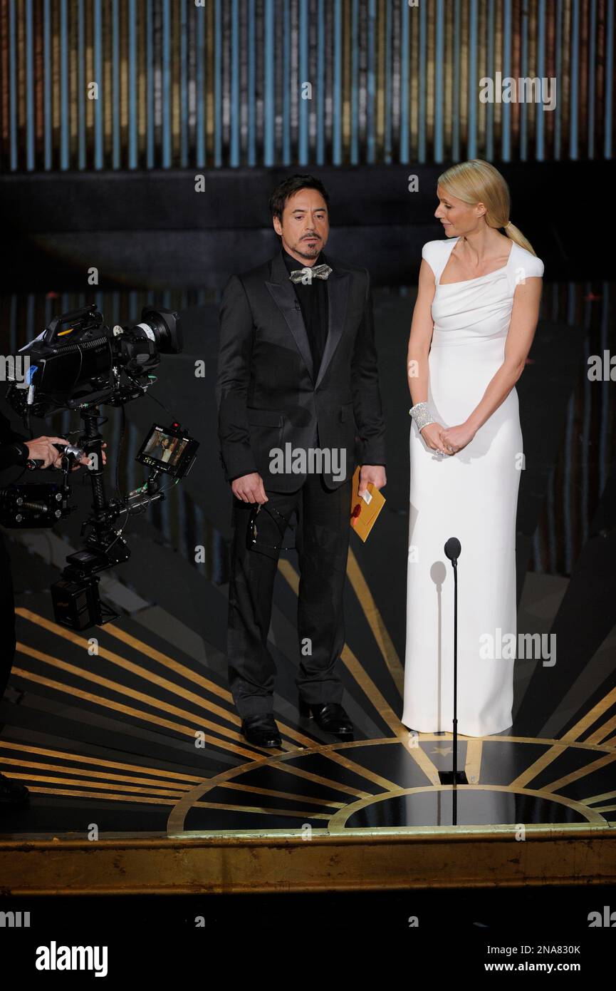 Robert Downey Jr., left, and Gwyneth Paltrow present an award onstage ...