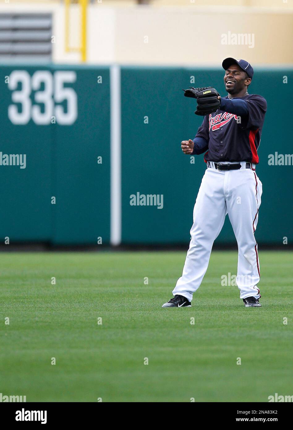 Atlanta Braves outfielder Michael Bourn laughs during spring training ...