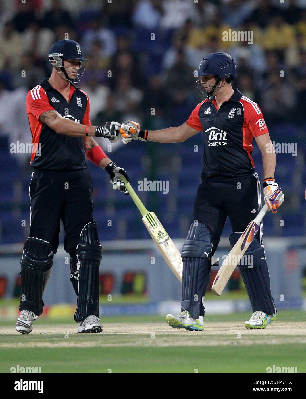 England's Kevin Pietersen, left, is congratulated his teammate Craig ...