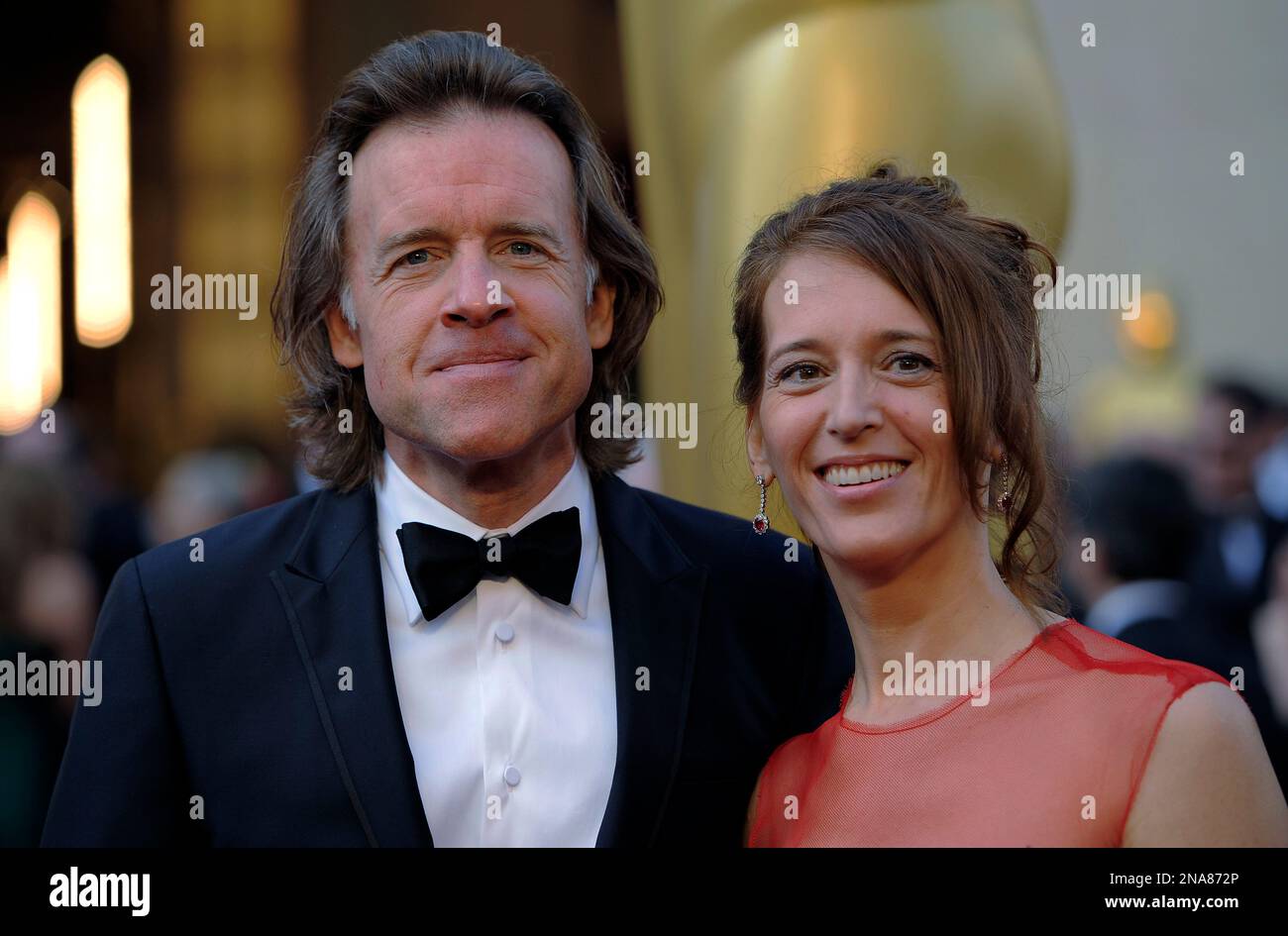 Bill Pohlad, left, and Michelle Pohlad arrive before the 84th Academy ...