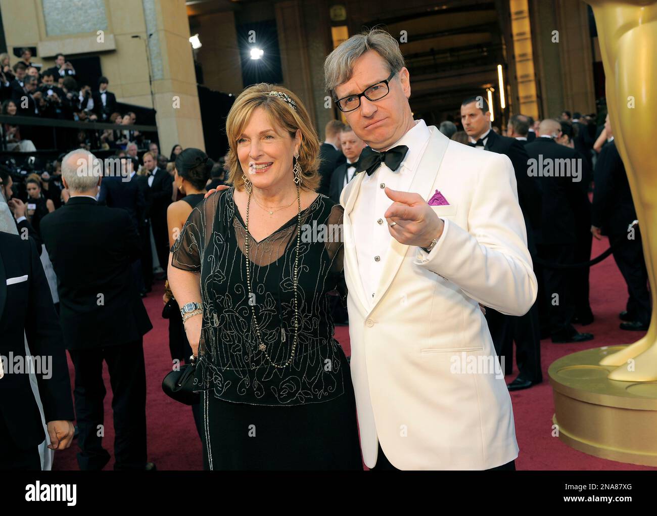 Paul Feig, right, and wife Laurie arrive before the 84th Academy Awards ...