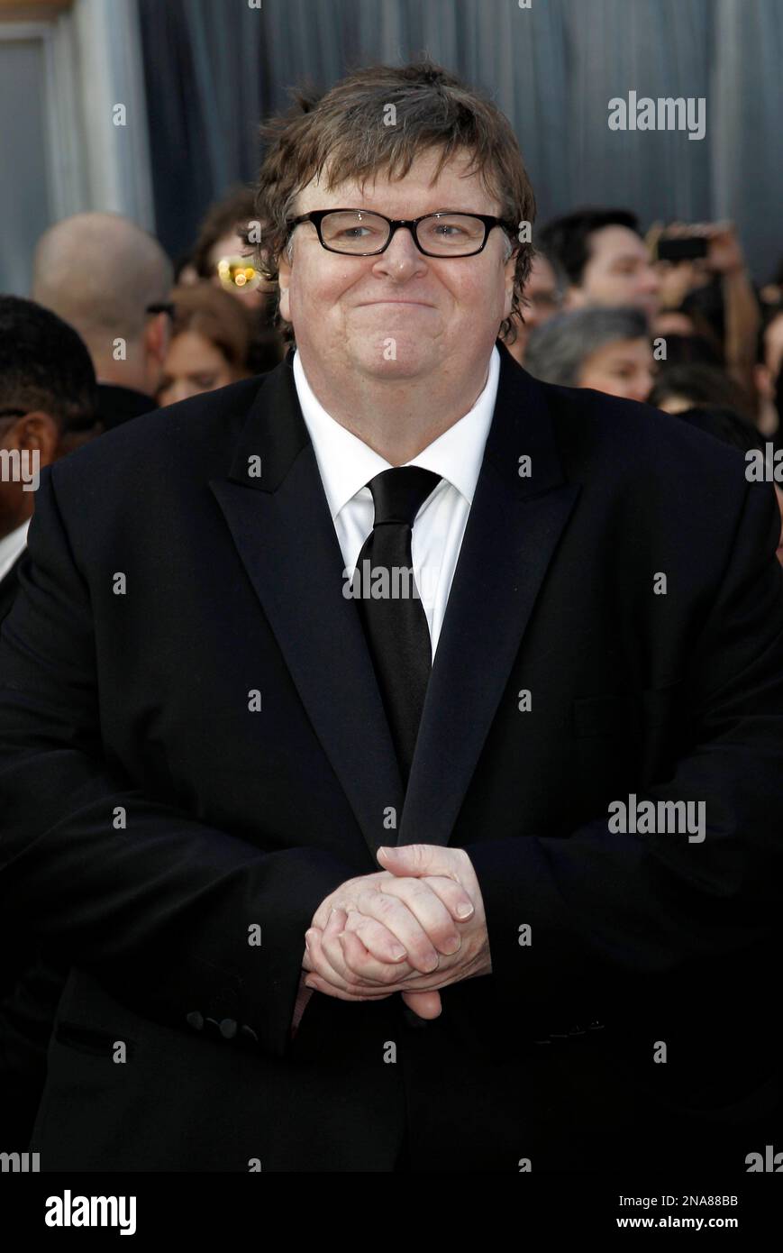 Filmmaker Michael Moore arrives before the 84th Academy Awards on ...