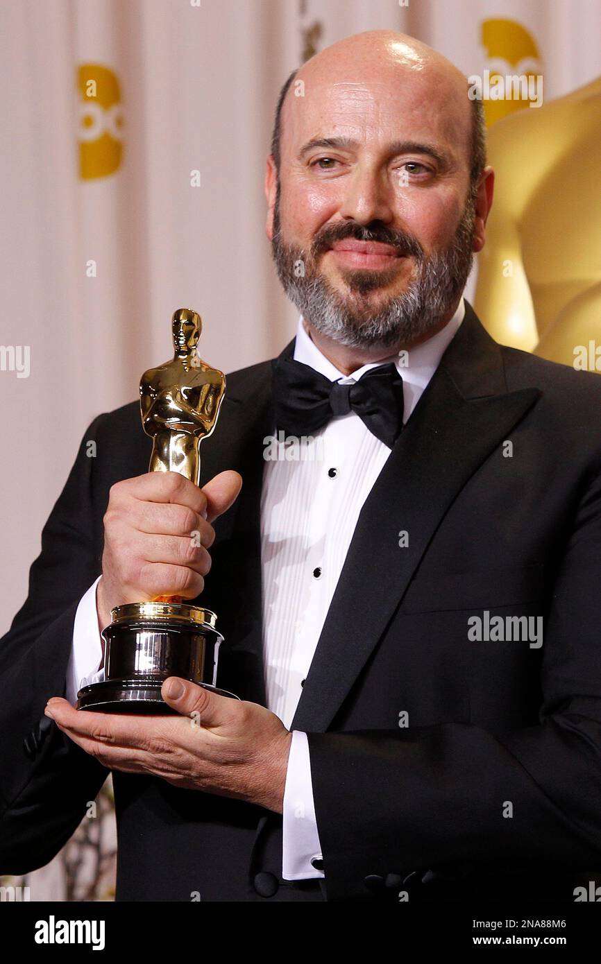 Mark Bridges poses with his award for best achievement in costume ...