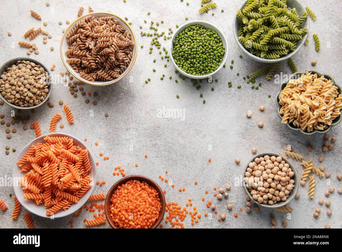 A variety of fusilli pasta made from different types of legumes, green ...