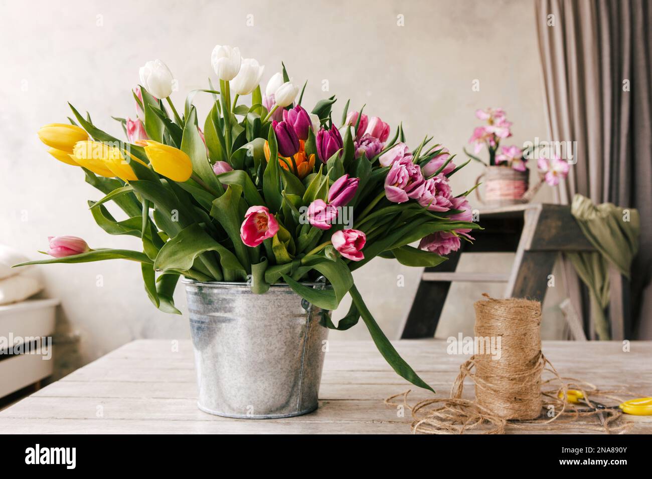 Tulip bouquet. Floristry workplace background Stock Photo - Alamy