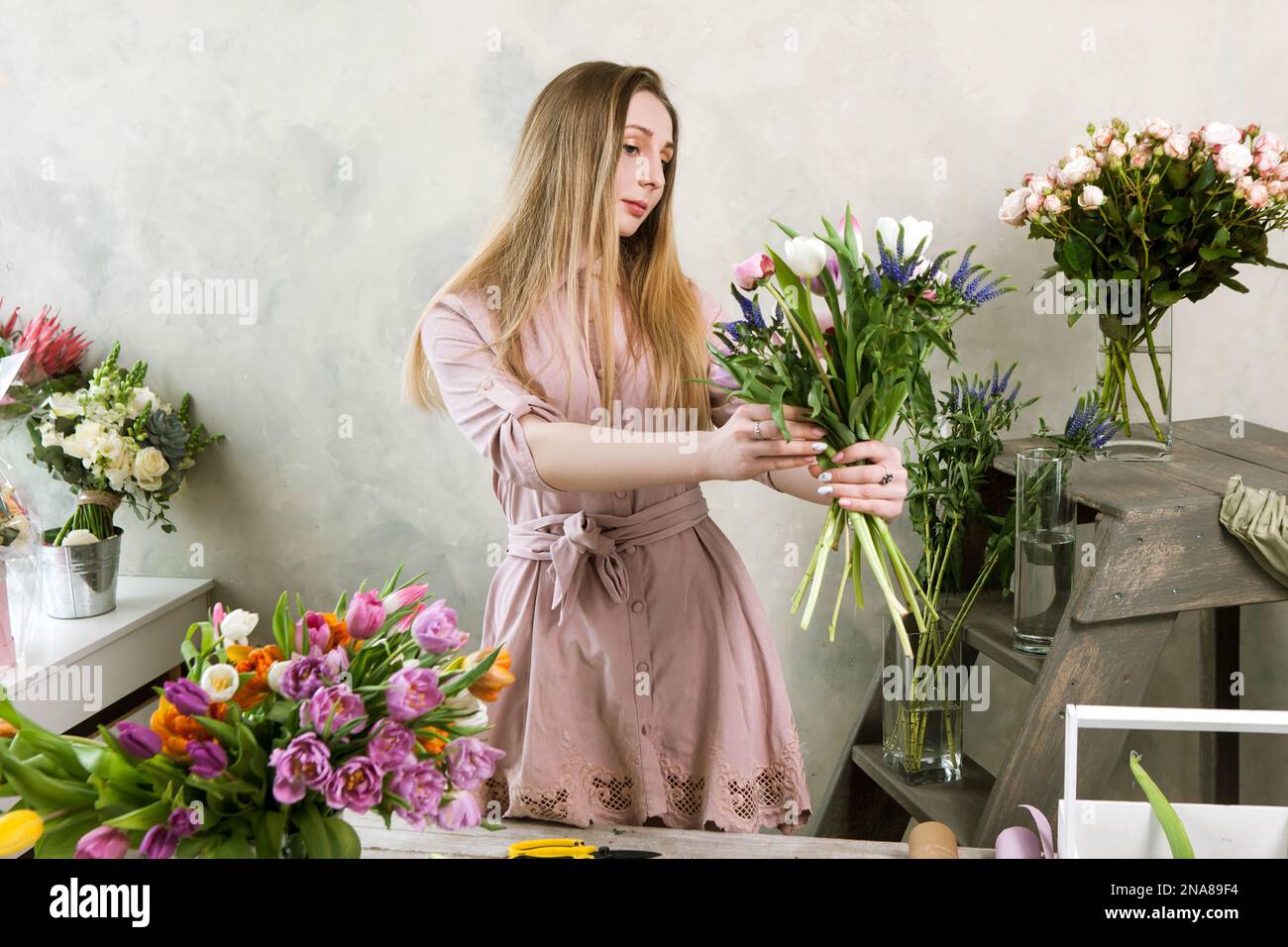 Making spring bunch in floristry flower shop Stock Photo - Alamy