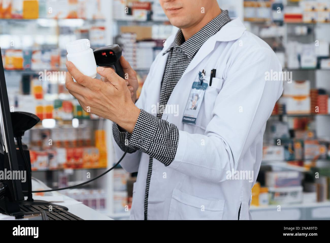 Pharmacist scanning medication scanner hi-res stock photography and ...