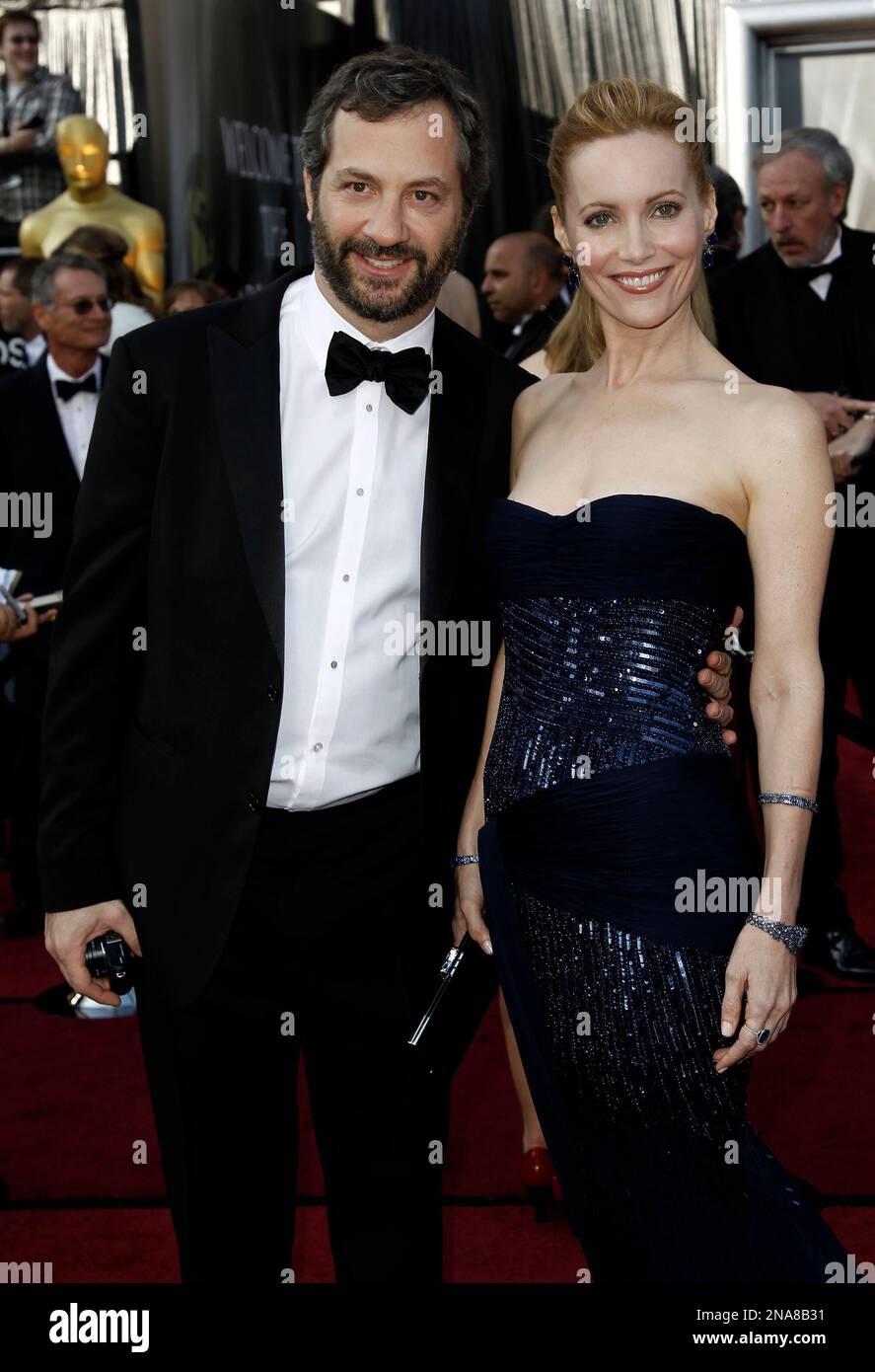 Judd Apatow, left, and Leslie Mann arrive before the 84th Academy ...