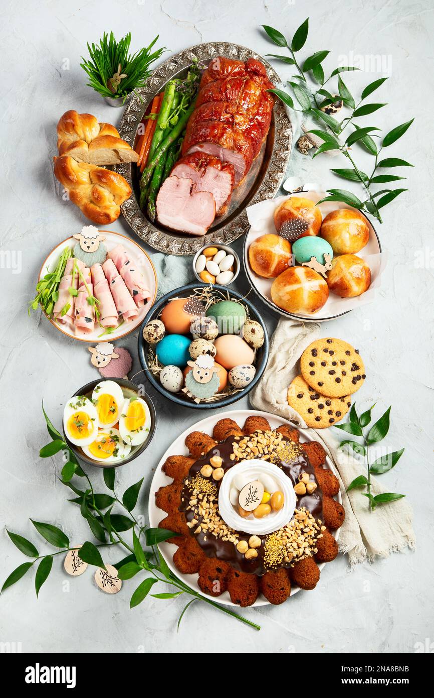 Classic Easter ham dinner. Top view table scene on a white background ...