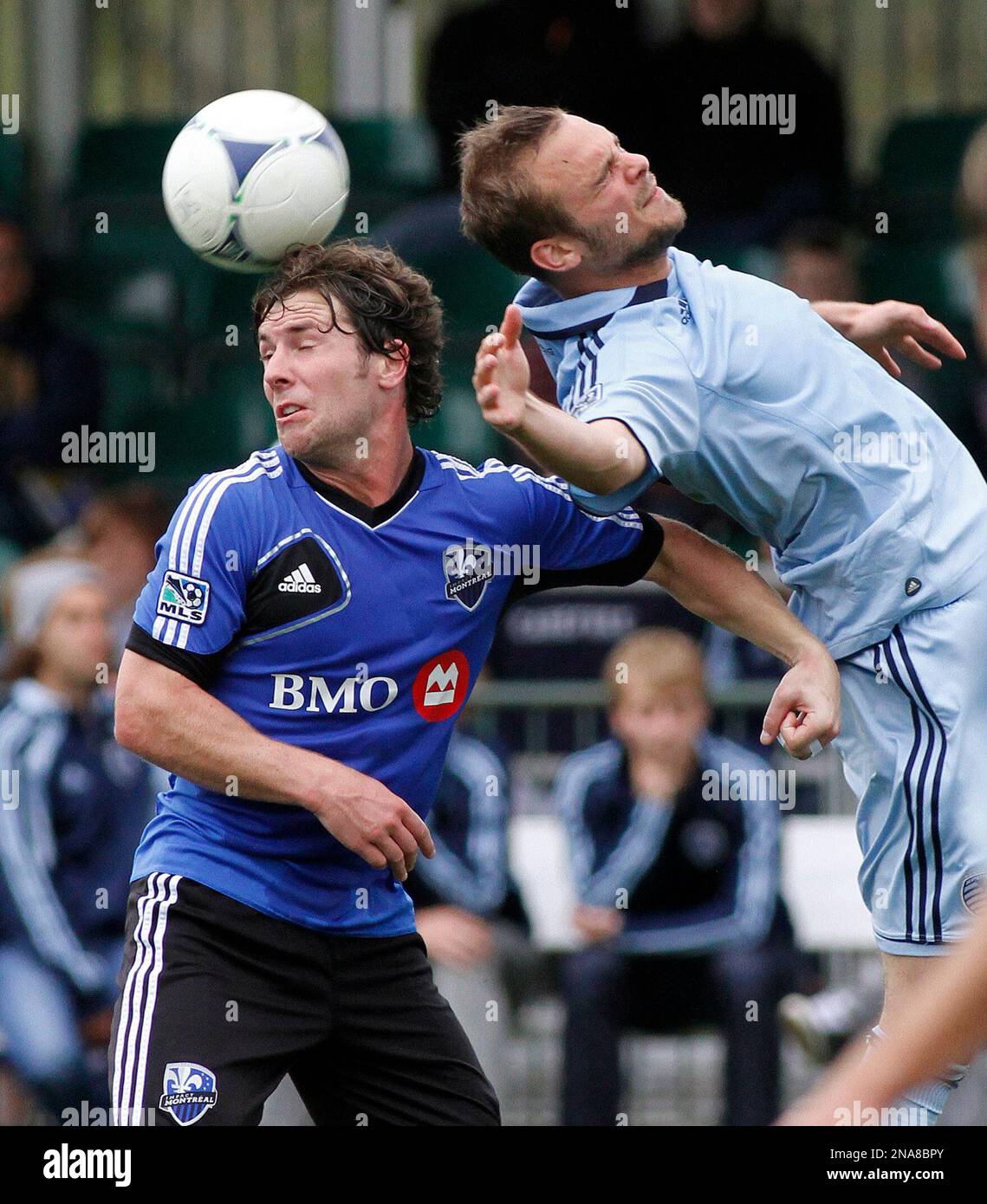 Sporting Kansas City's Sacir Hot, right, heads the ball against ...