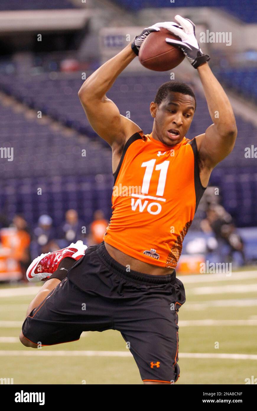 Arizona receiver Juron Criner runs a drill at the NFL football scouting ...