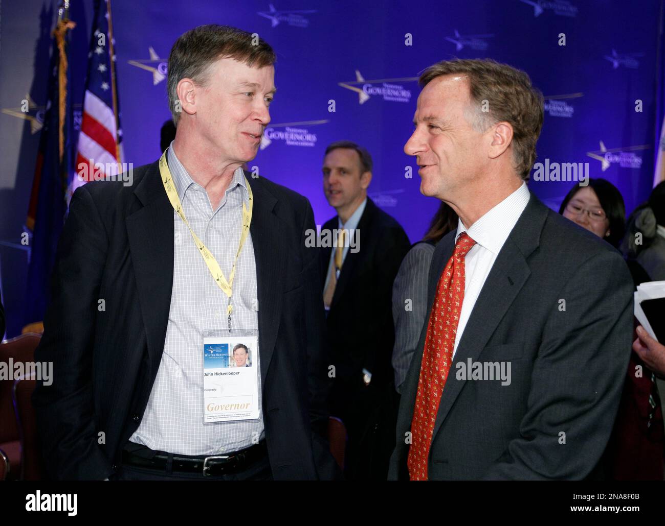 Colorado Gov. John Hickenlooper, left, speaks with Tennessee Gov. Bill ...