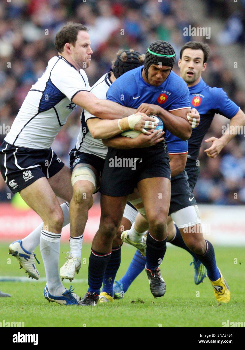 France's Thierry Dusautoir, front right, is tackled by Scotland's ...