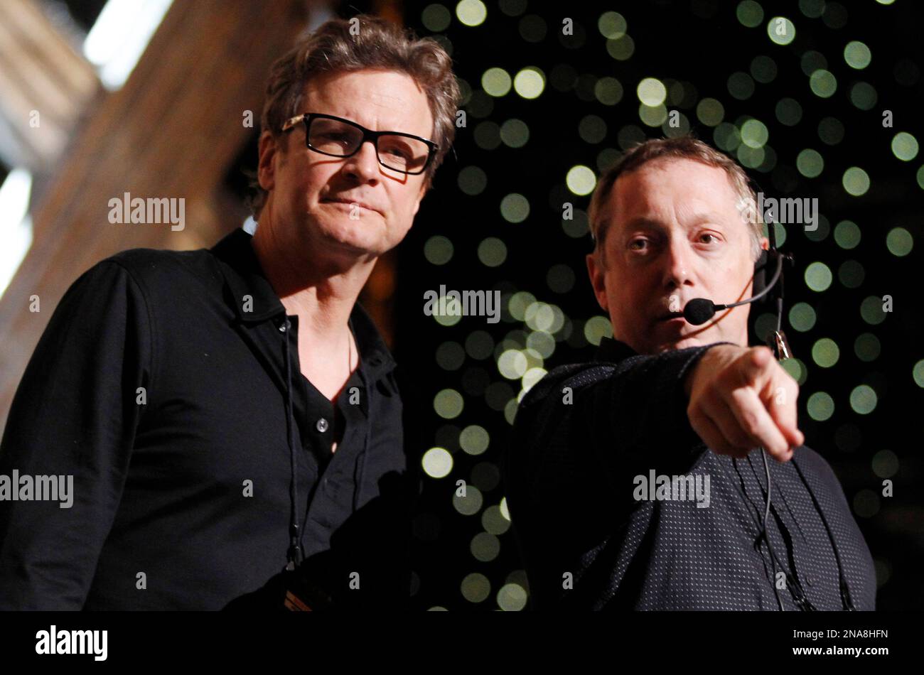 Actor Colin Firth, left, and stage manager Gary Natoli talk during ...