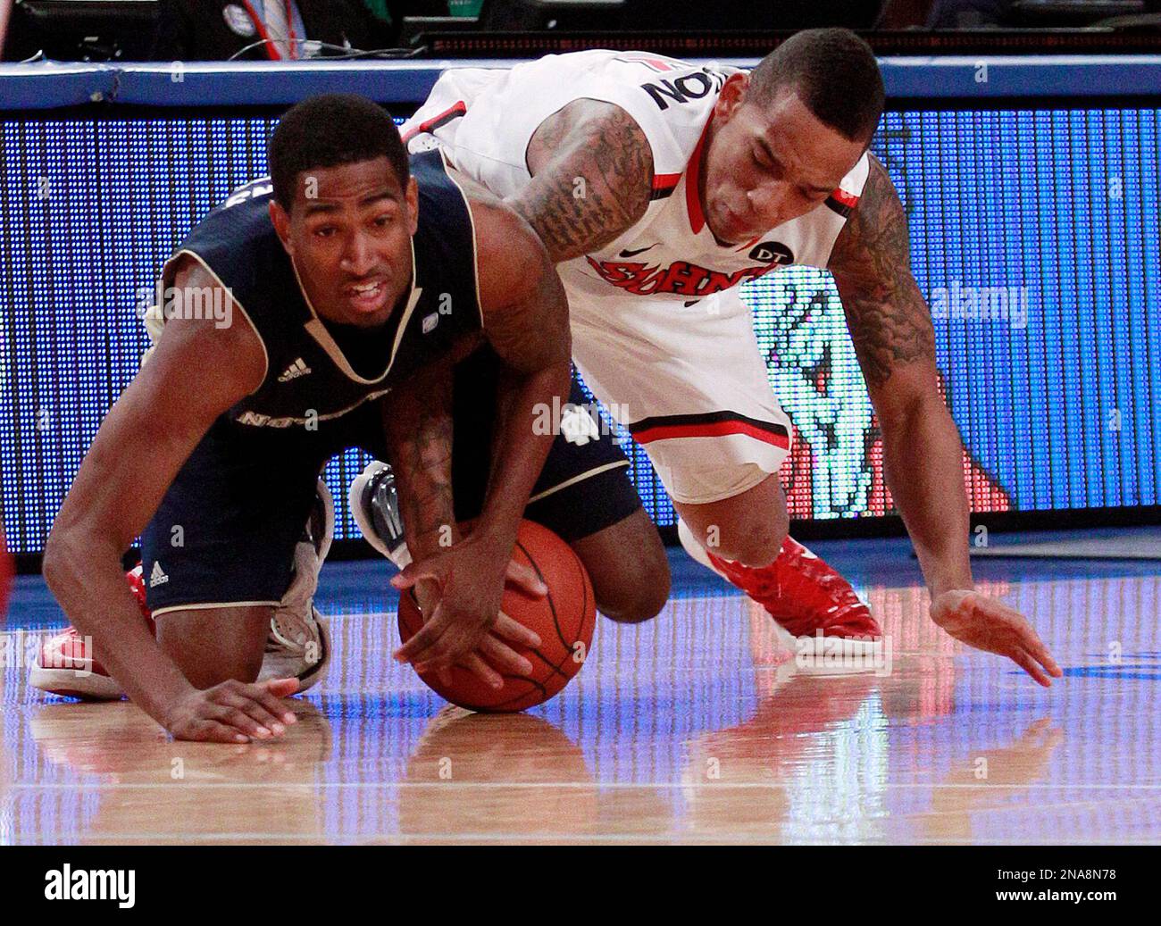 Notre Dame's Eric Atkins, left, battles for control of the ball with St ...