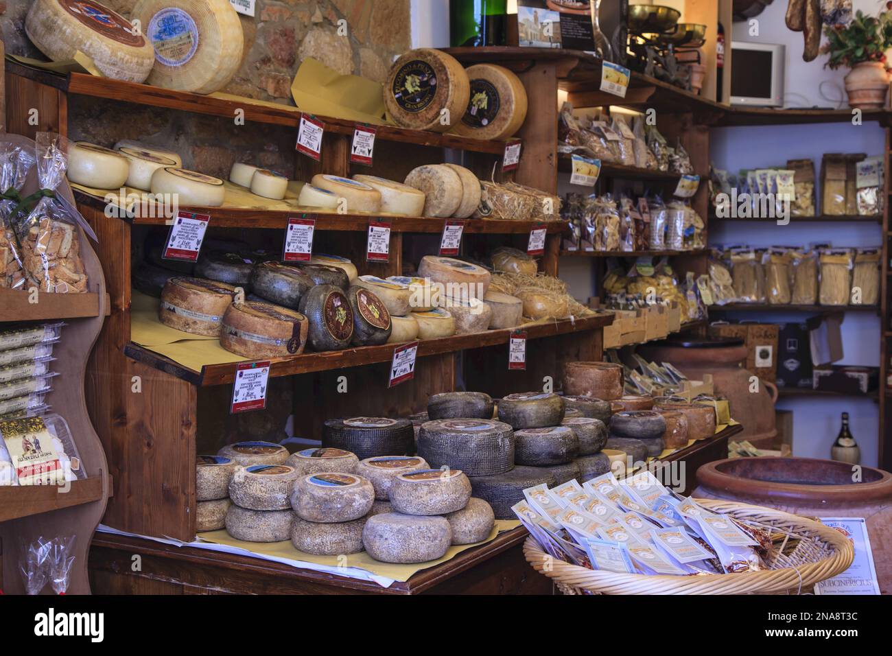 A variety of cheese on display in a cheese shop; Volterra, Italy Stock ...
