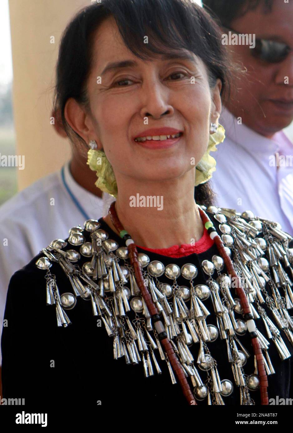 In this photo taken Friady, Feb. 24, 2012, clad in Kachin traditional ...