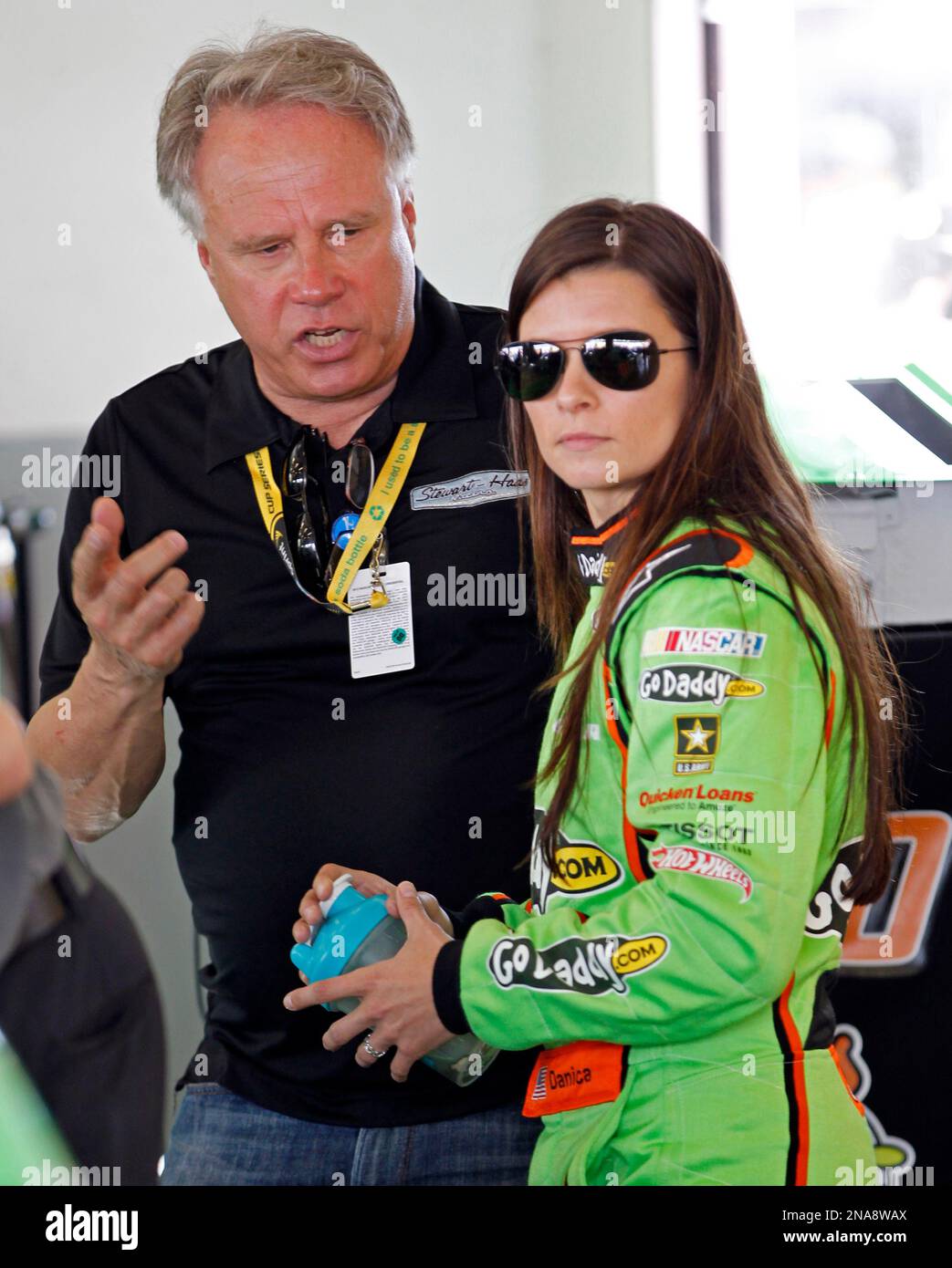 Team co-owner Gene Haas, left, talks with driver Danica Patrick, right ...