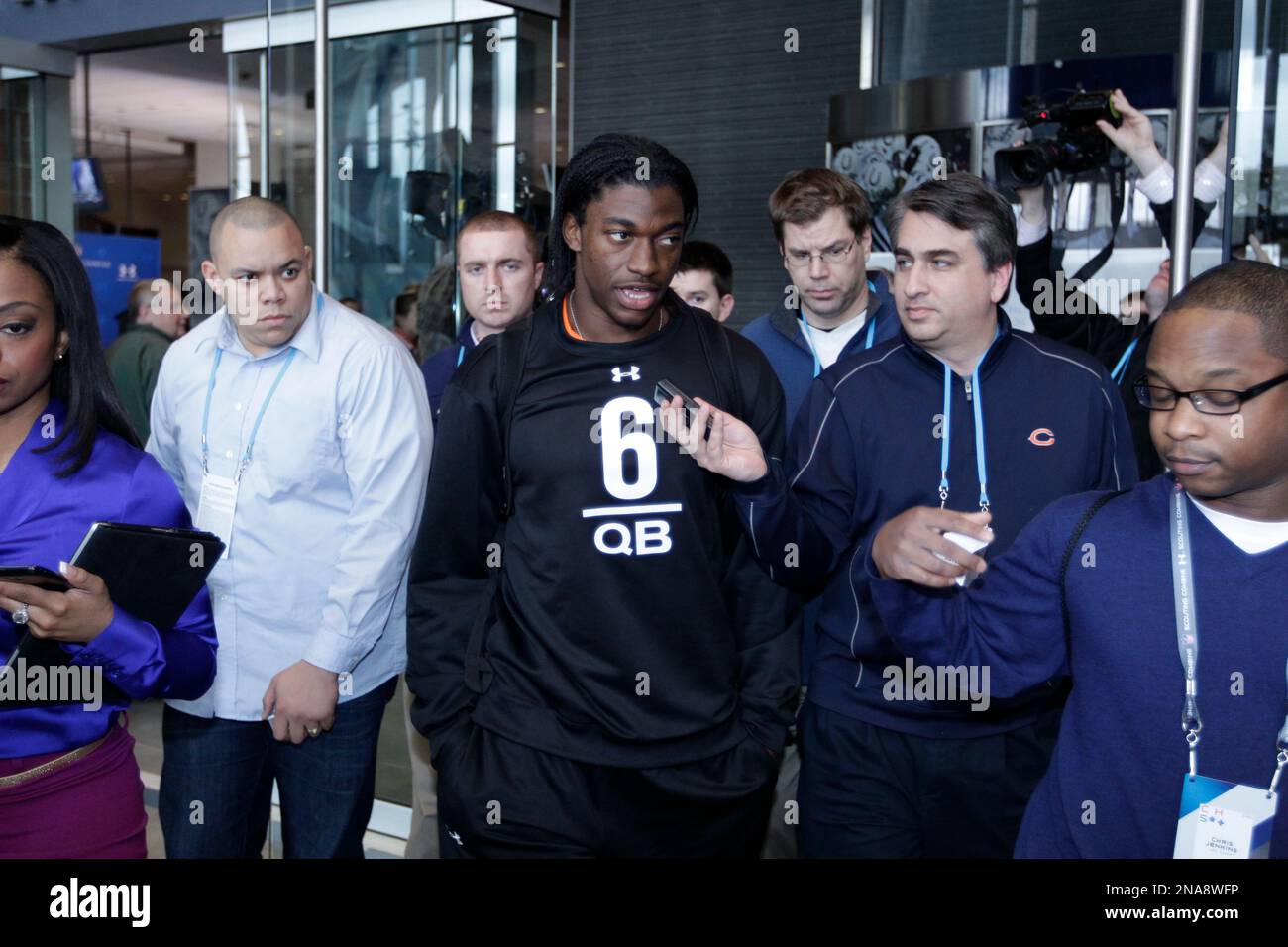 Baylor quarterback Robert Griffin III is questioned as he leaves a news ...