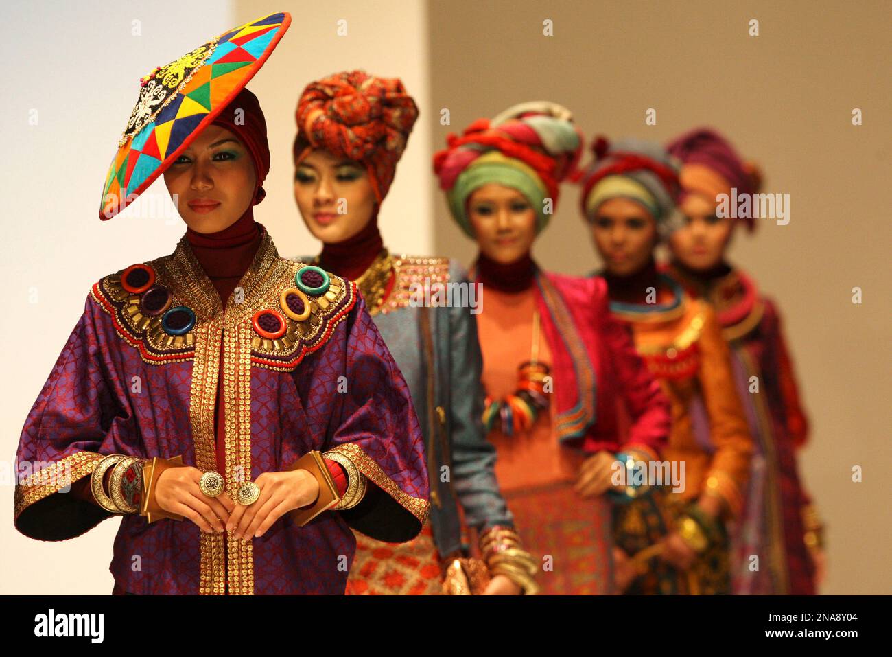 Indonesian models present creations of Indonesian fashion designer Dian ...