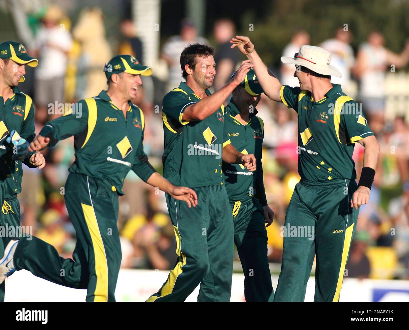 Australian fast bowler Ben Hilfenhaus, center, celebrates taking the ...