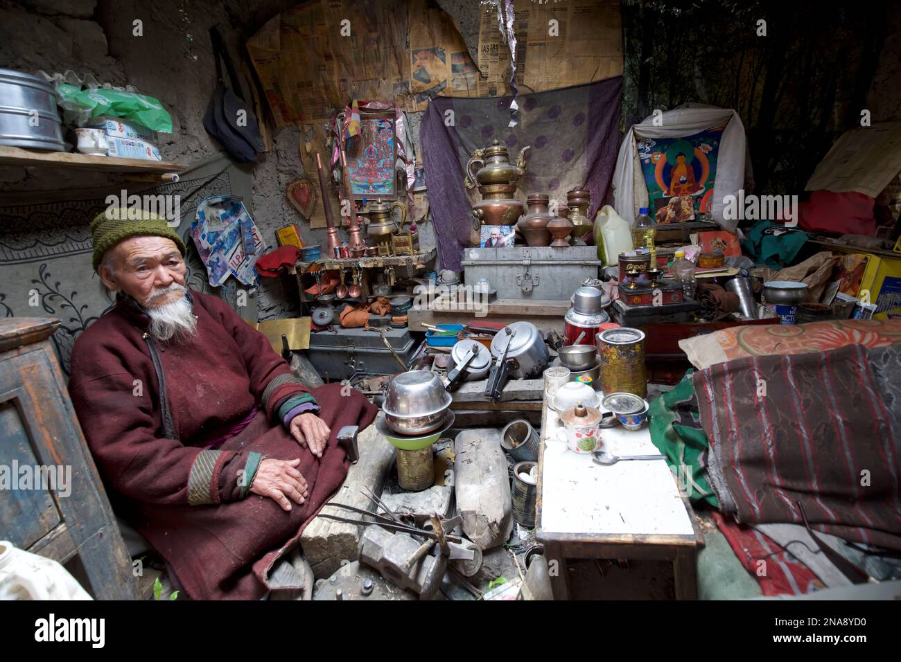 Metal worker in his workshop in the mountain village of Chilling in the ...