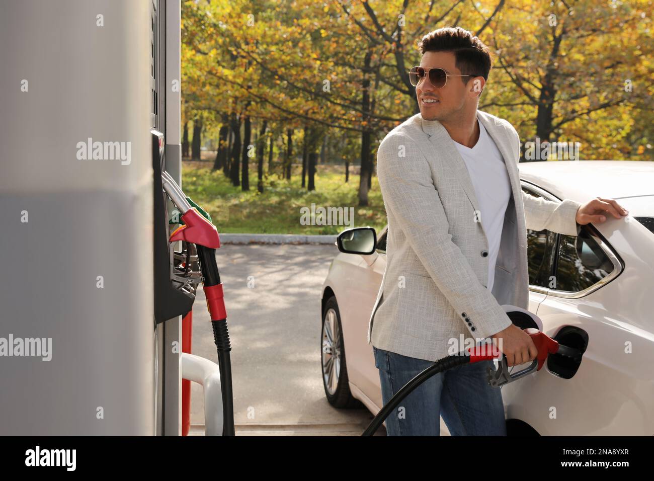 Man refueling car at self service gas station Stock Photo - Alamy