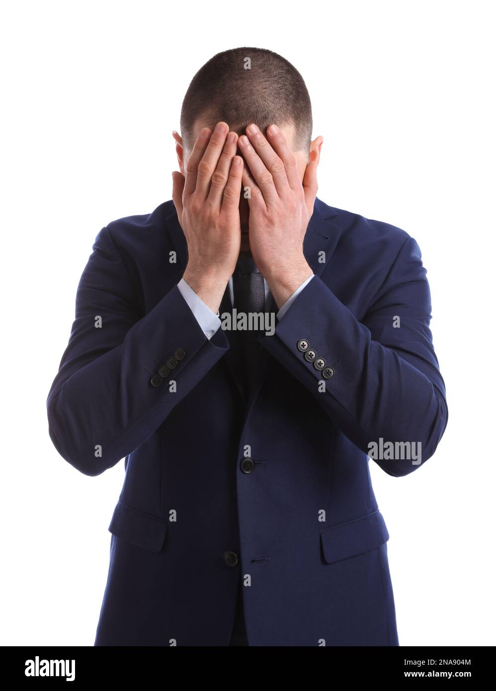 Man in suit closing his face with hands on white background Stock Photo ...