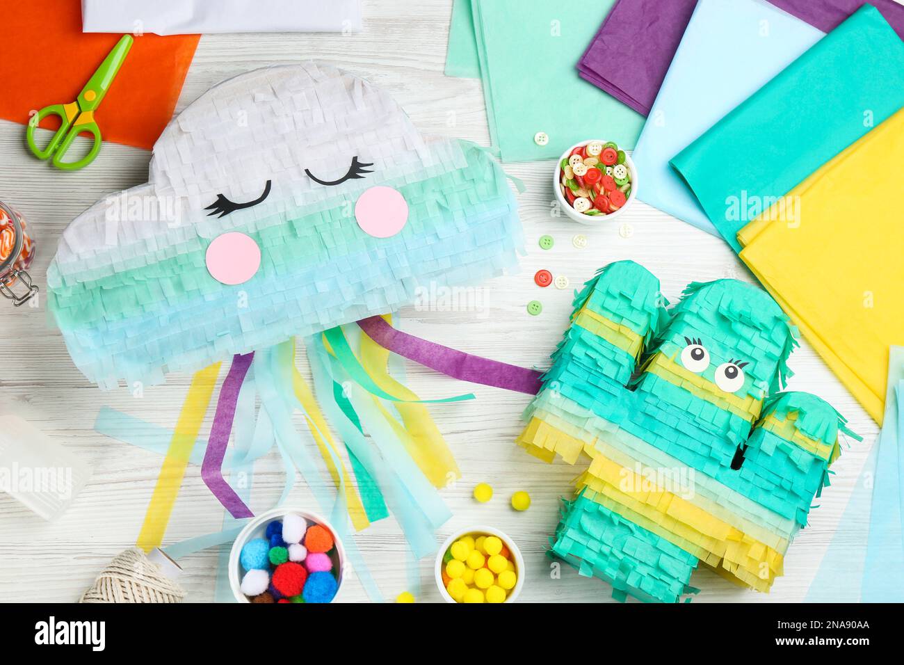 Flat lay composition with cardboard cactus and cloud on white wooden ...