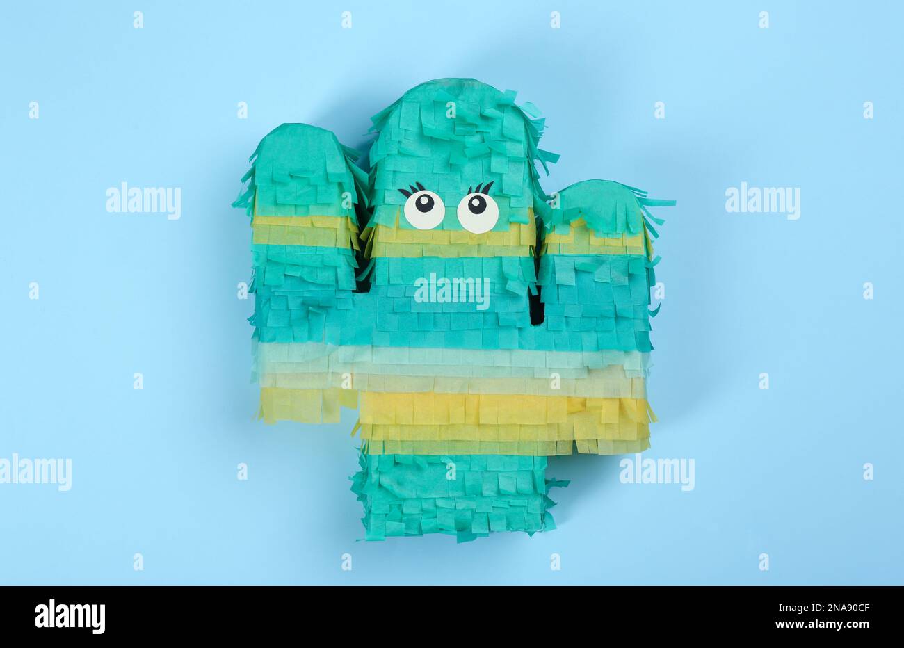 Bright cactus pinata on light blue background, top view Stock Photo - Alamy