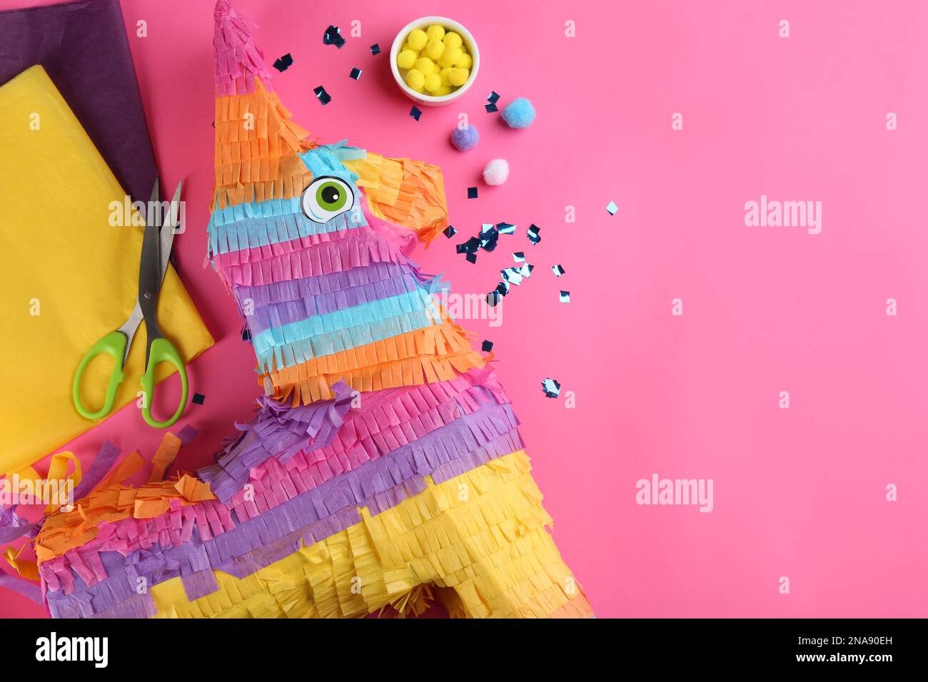 Flat lay composition with cardboard donkey and materials on pink ...