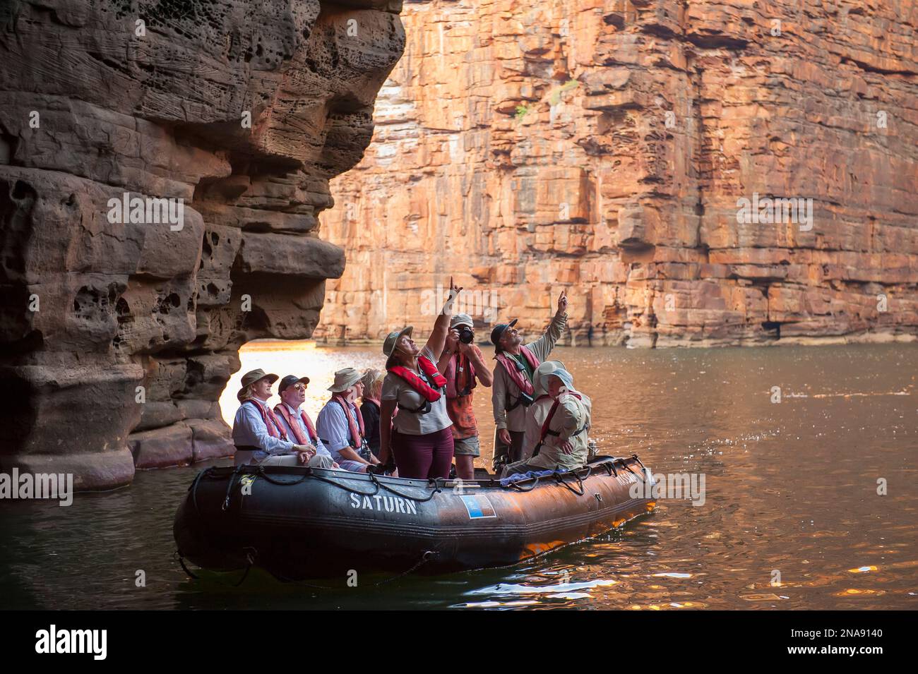 Expedition travellers aboard inflatable boats explore King George River ...
