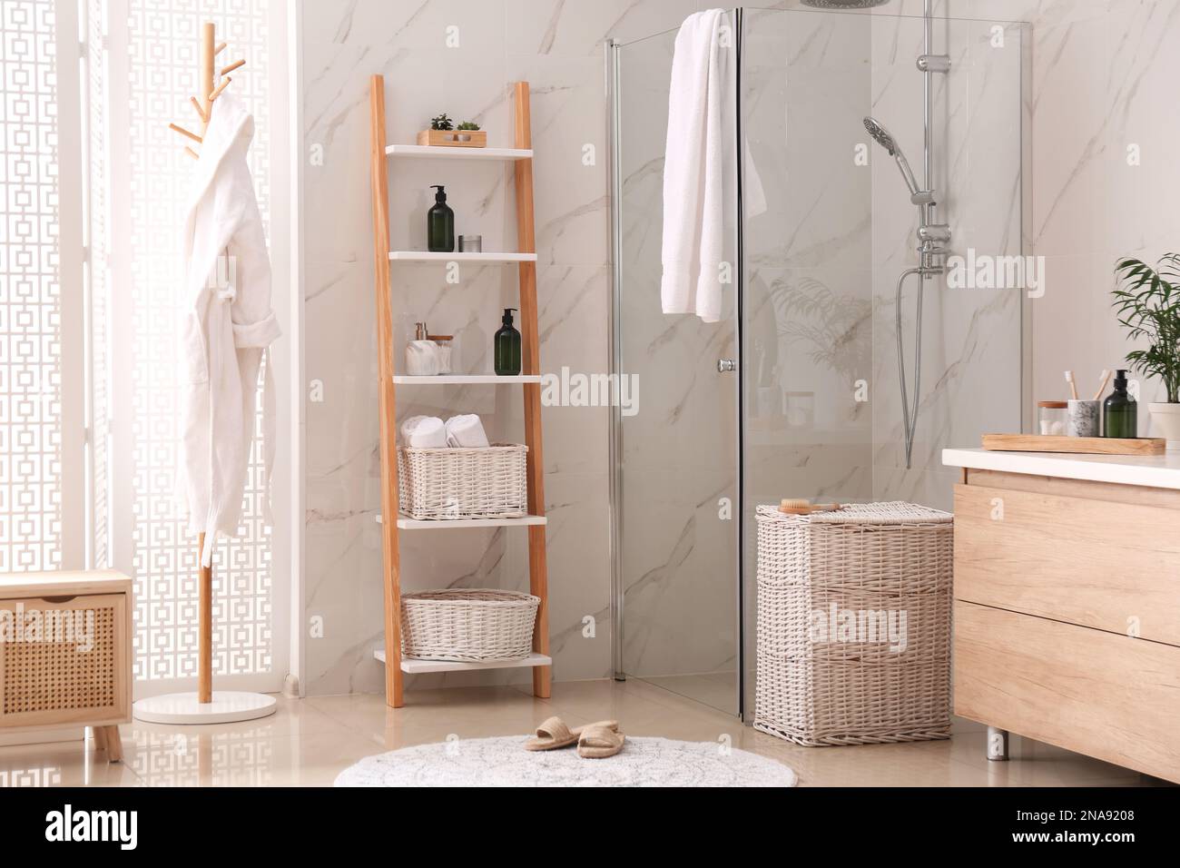 Modern bathroom interior with decorative ladder and shower stall Stock ...