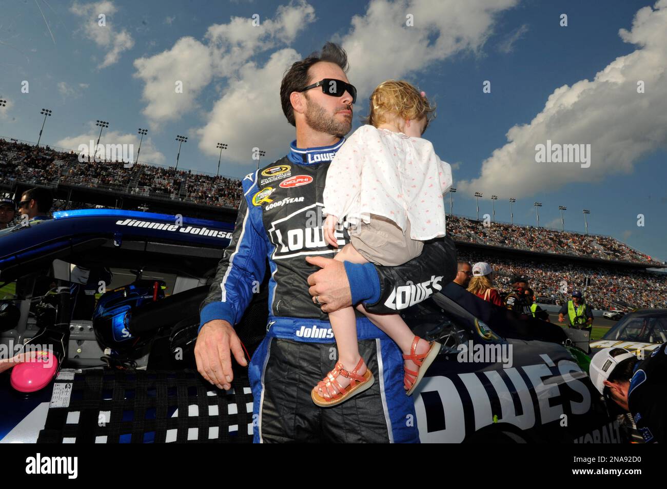 Jimmie Johnson holds his daughter, Genevieve Marie, before the second ...
