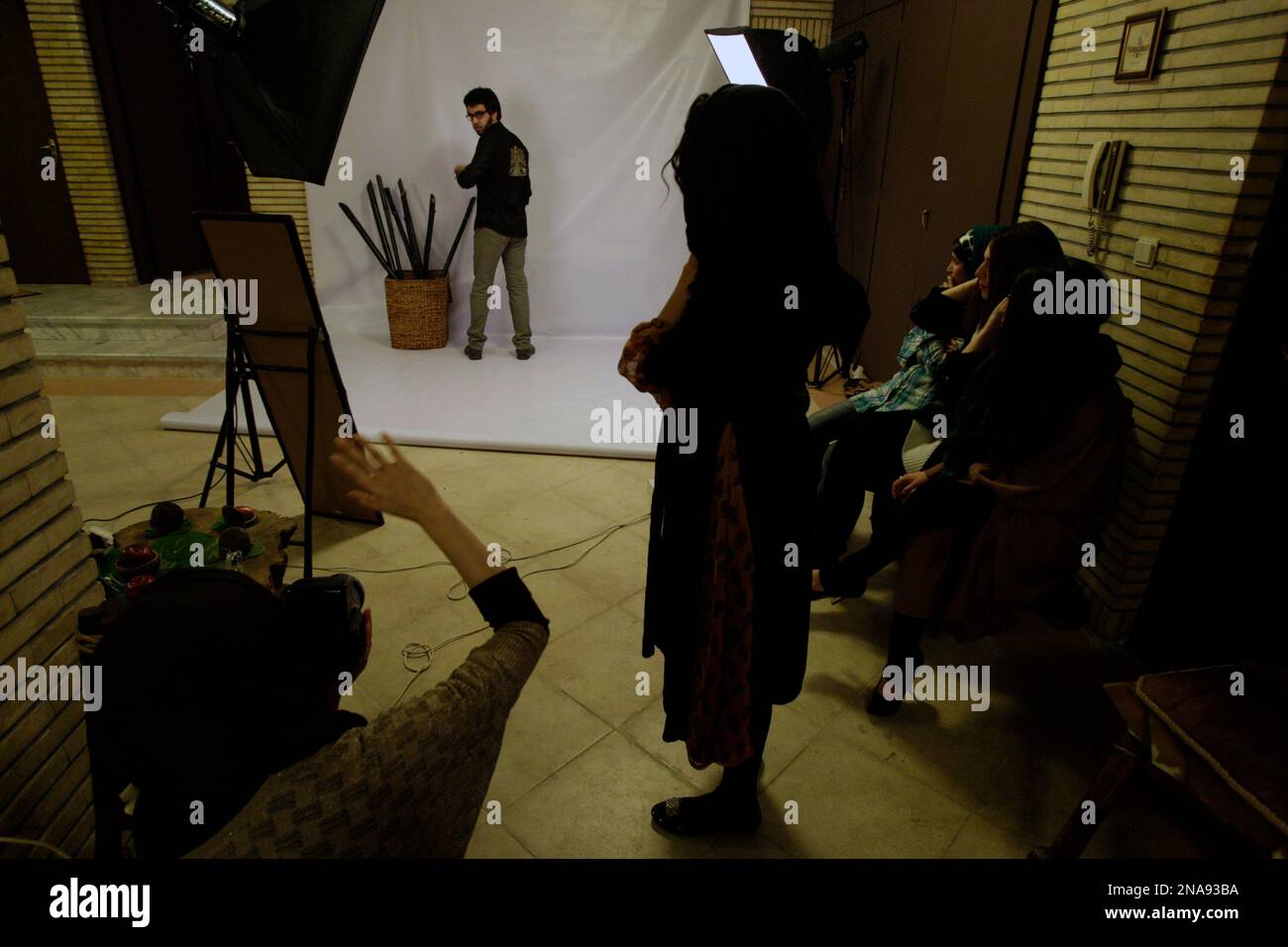 Iranian model Mohammad Reza Moghimi, center, poses as he wears dress ...