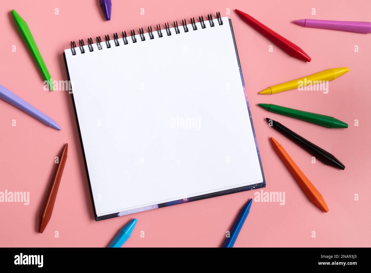 Mock up of empty scketchbook white paper on pastel pink background ...