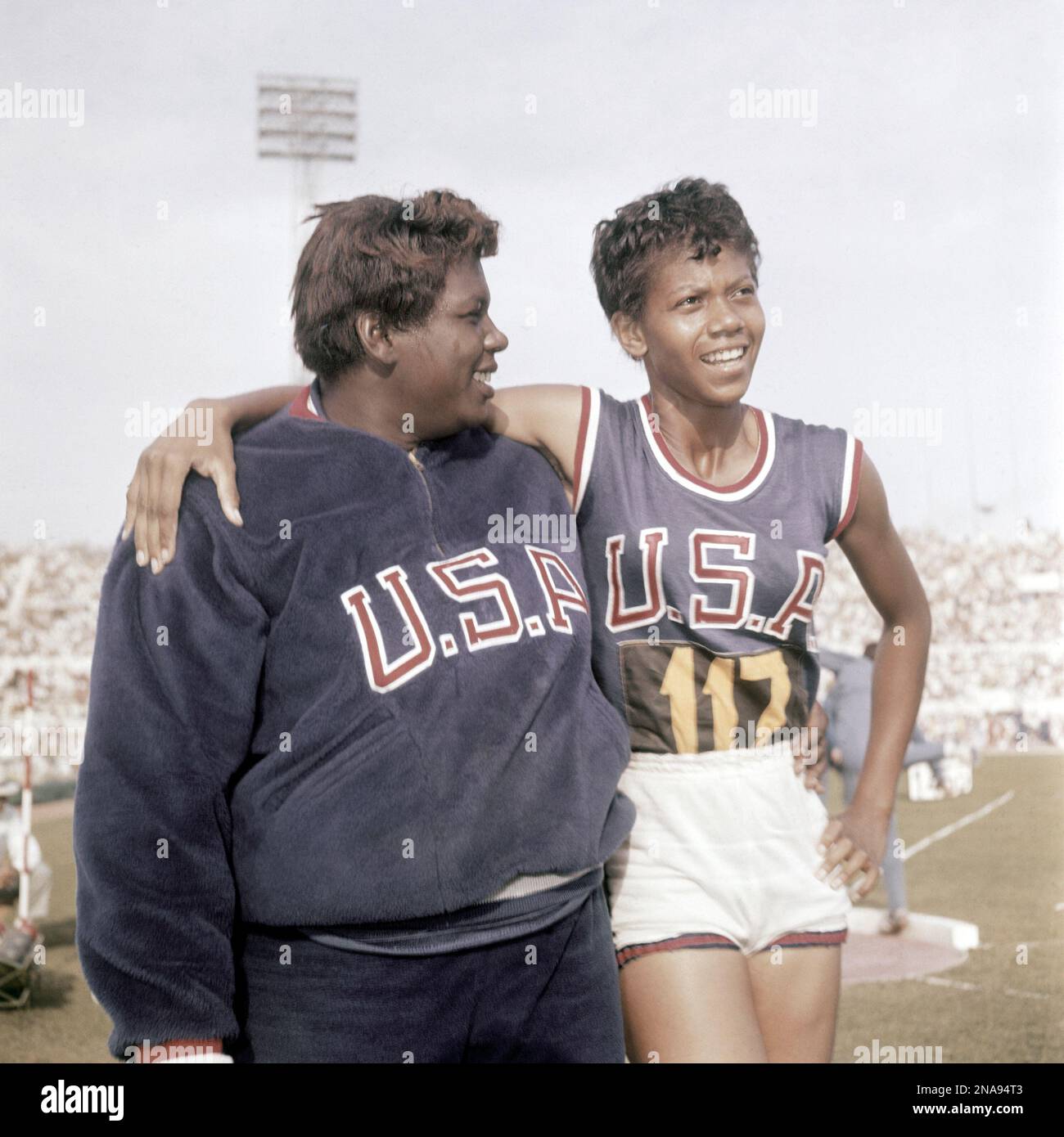 US athlete Wilma Rudolph, right, is hugged by an unidentified woman at ...