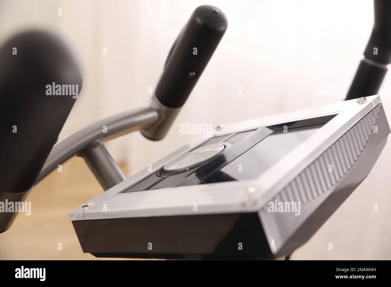 Control panel of modern elliptical machine cross trainer on blurred ...