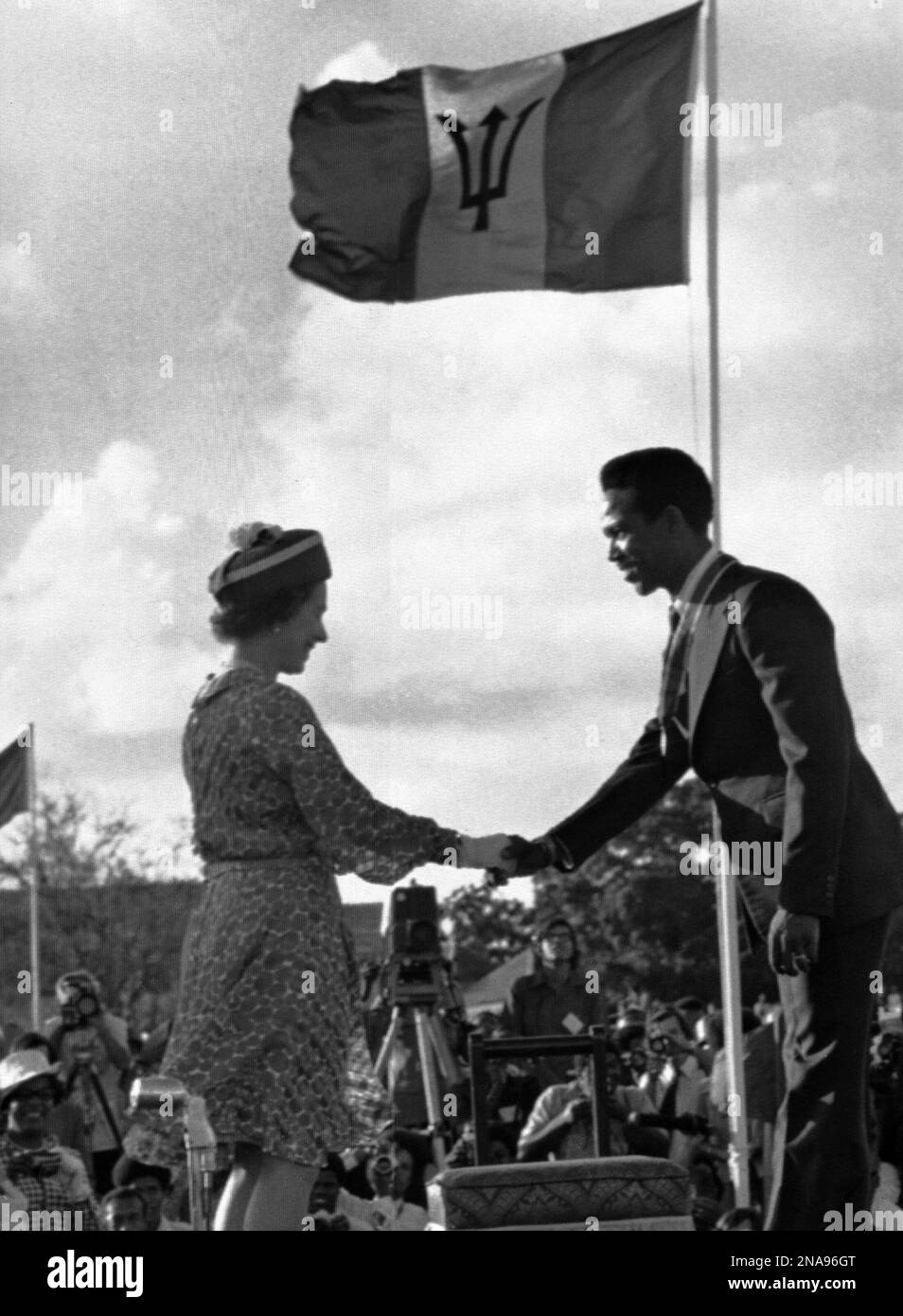 Britain's Queen Elizabeth II congratulates Sir Garfield Sobers after ...