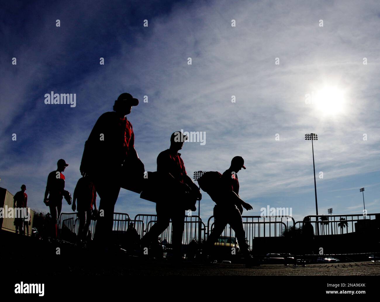 Los Angeles Angels players make their way to a spring training baseball ...