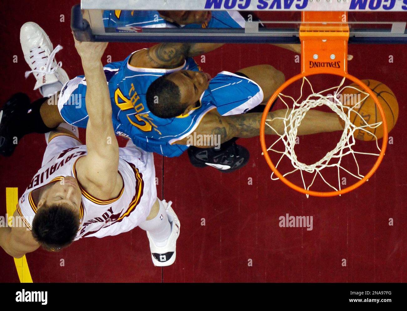 New Orleans Hornets' Lance Thomas scoops a shot inside Cleveland ...