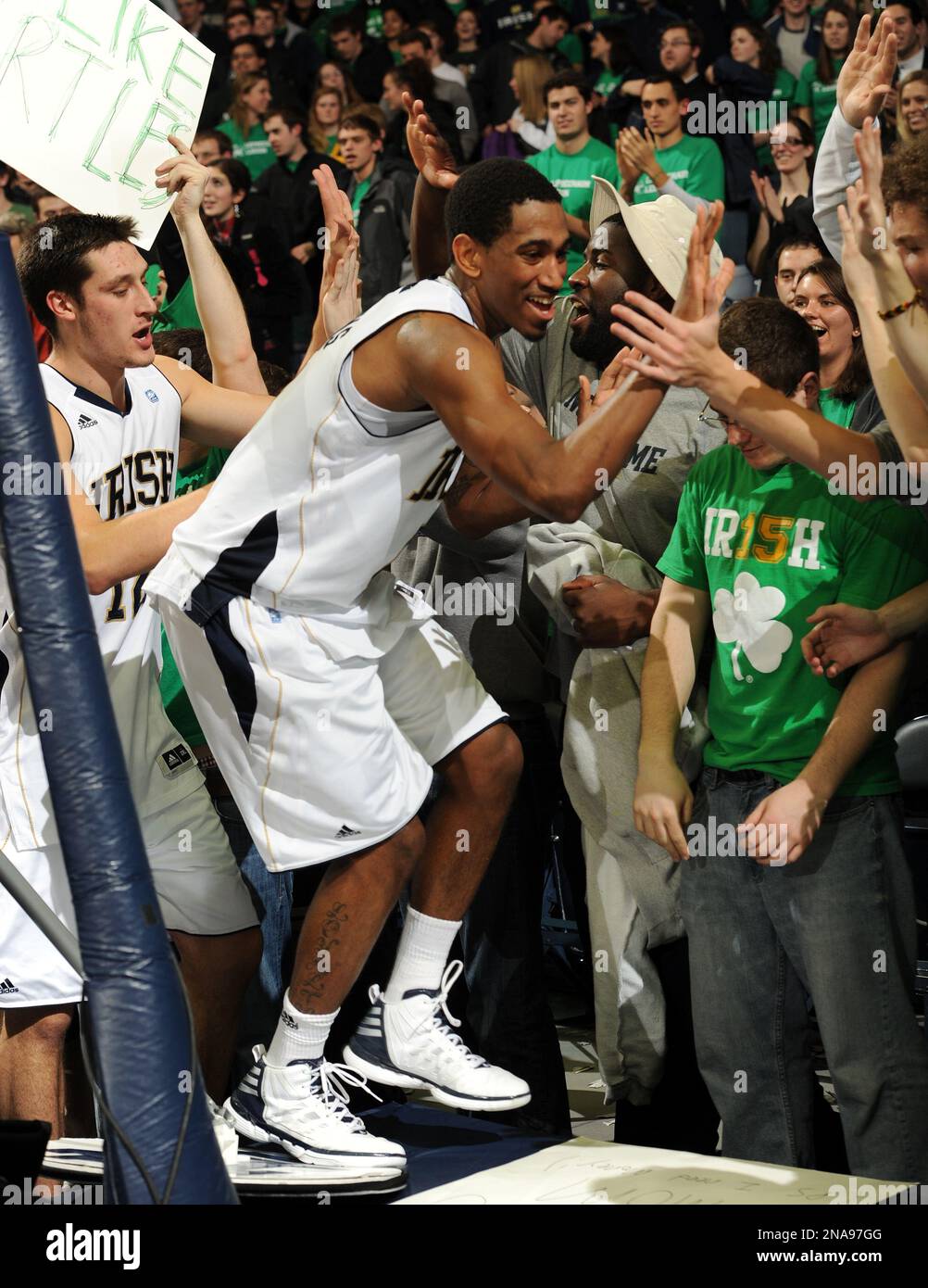 Notre Dame guard Eric Atkins celebrates with students following their ...